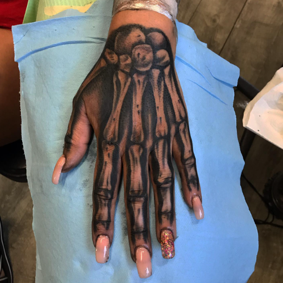 18 Terrifying and Cool Skeleton Hand Tattoos Design - Psycho Tats