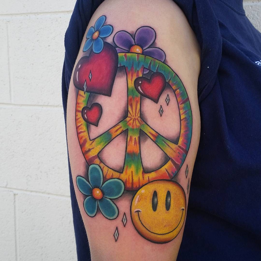 37 Tranquil Ink: Exploring the World of Peace Sign Tattoos - Psycho Tats