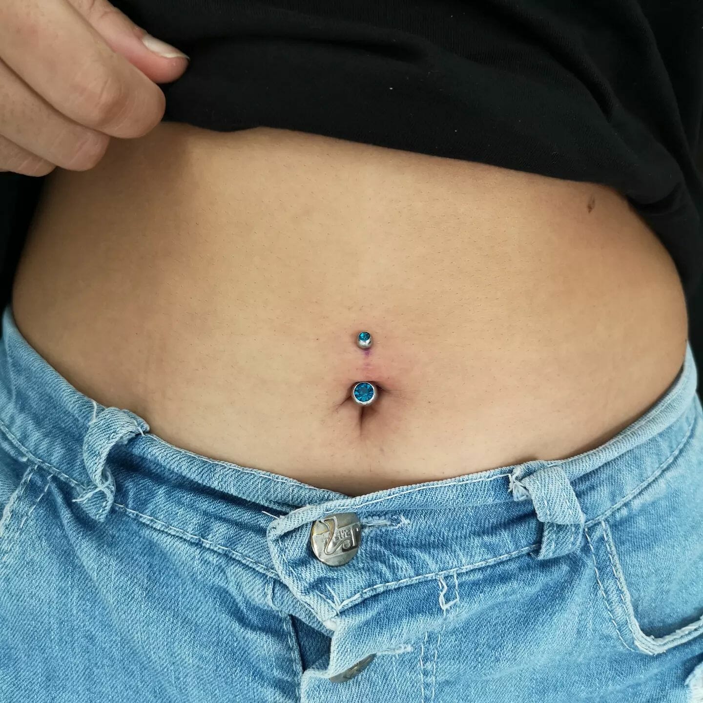 Can You Swim With A Belly Button Piercing? - Psycho Tats