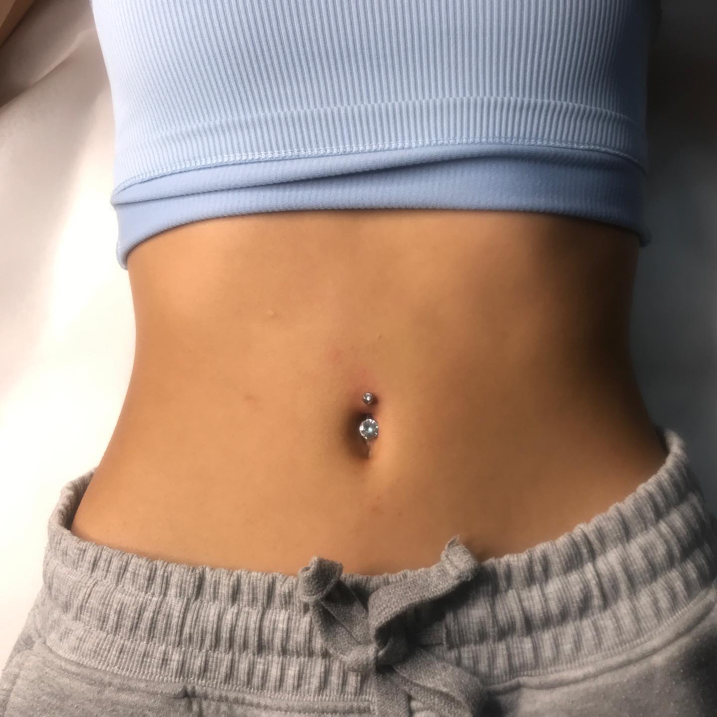 Which Is Better, Top Belly Button Piercing Or Bottom Belly Piercing? - Psycho Tats