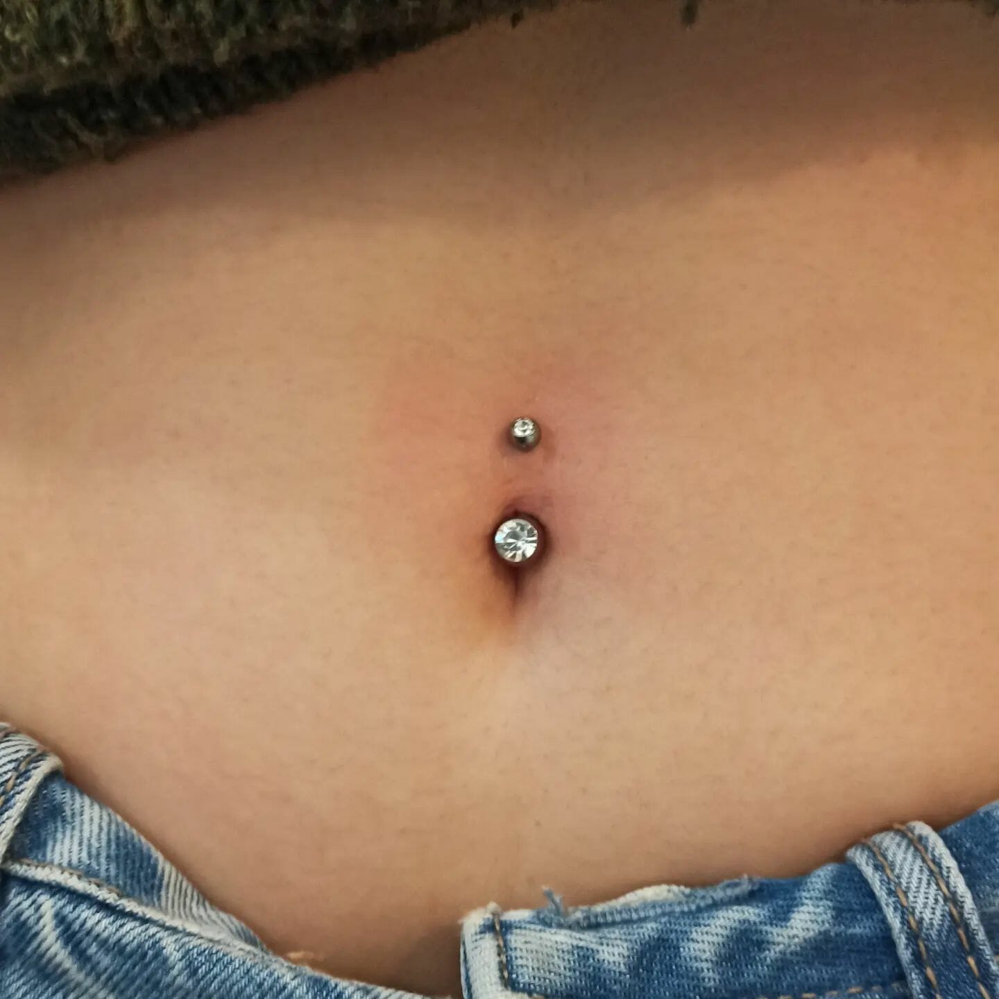 How To Reduce A Piercing Scar Around The Belly Button? - Psycho Tats