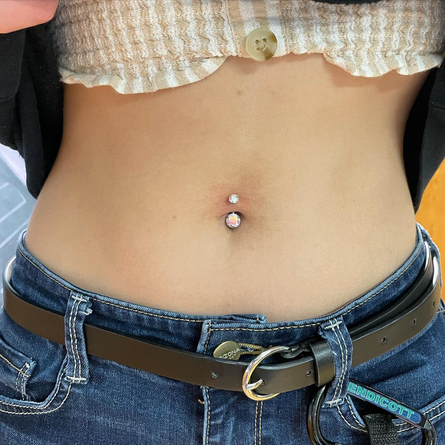 How To Reduce A Piercing Scar Around The Belly Button? - Psycho Tats
