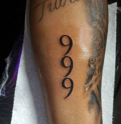 Decoding the Symbolism: The Meaning Behind 999 Number Tattoos - Psycho Tats