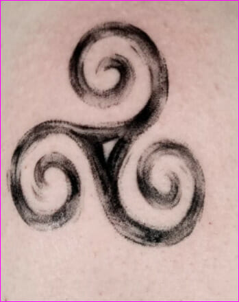 15 Triskele Tattoo Art Designs That Embrace the Power of Celtic ...