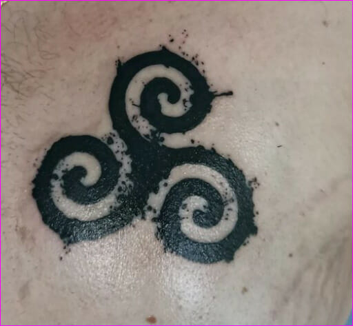 15 Triskele Tattoo Art Designs That Embrace the Power of Celtic ...