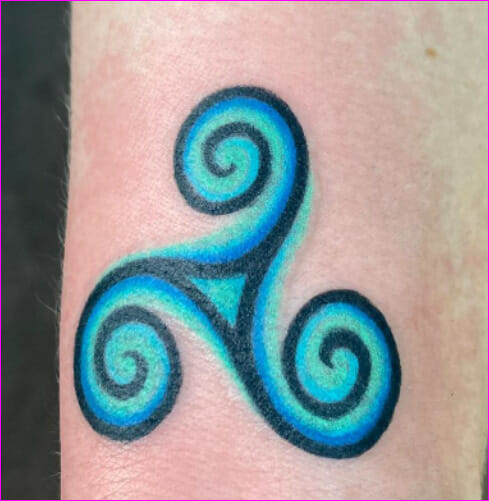 15 Triskele Tattoo Art Designs That Embrace the Power of Celtic ...