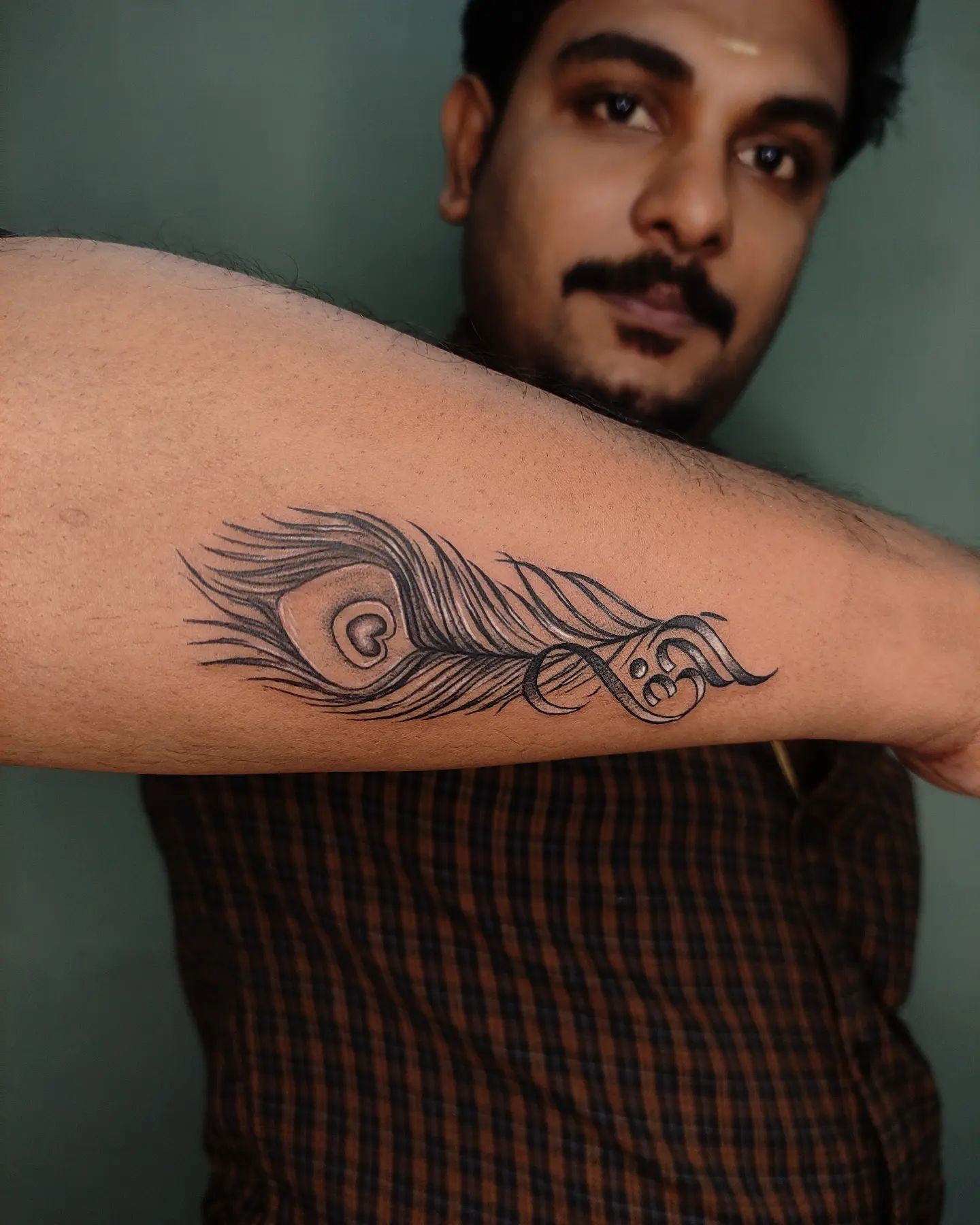 114 Mor Pankh Tattoo Ideas- Embracing Lord Krishna’s Beauty - Psycho Tats