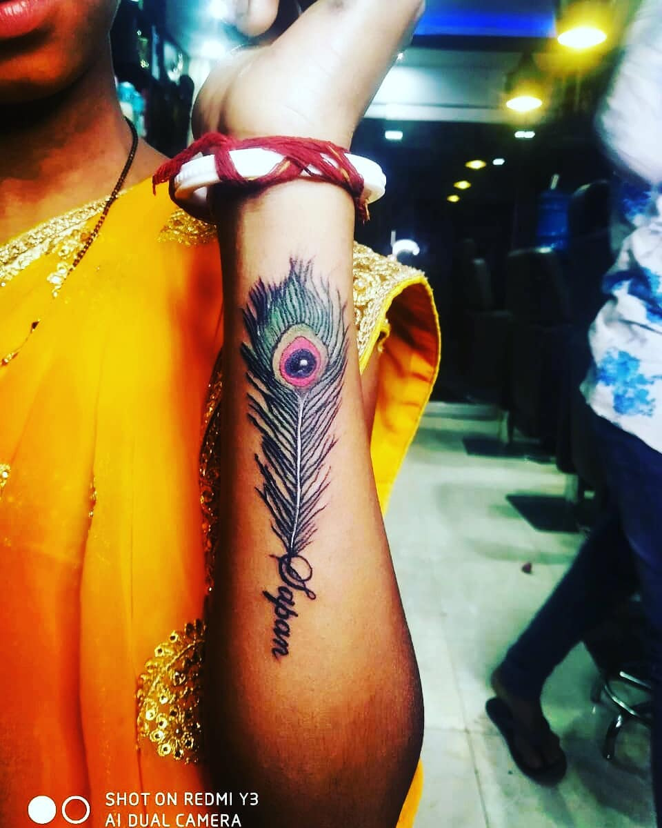 114 Mor Pankh Tattoo Ideas- Embracing Lord Krishna’s Beauty - Psycho Tats