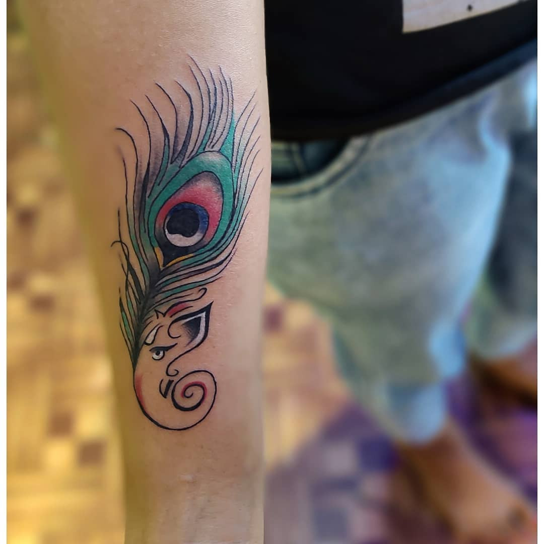 114 Mor Pankh Tattoo Ideas- Embracing Lord Krishna’s Beauty - Psycho Tats