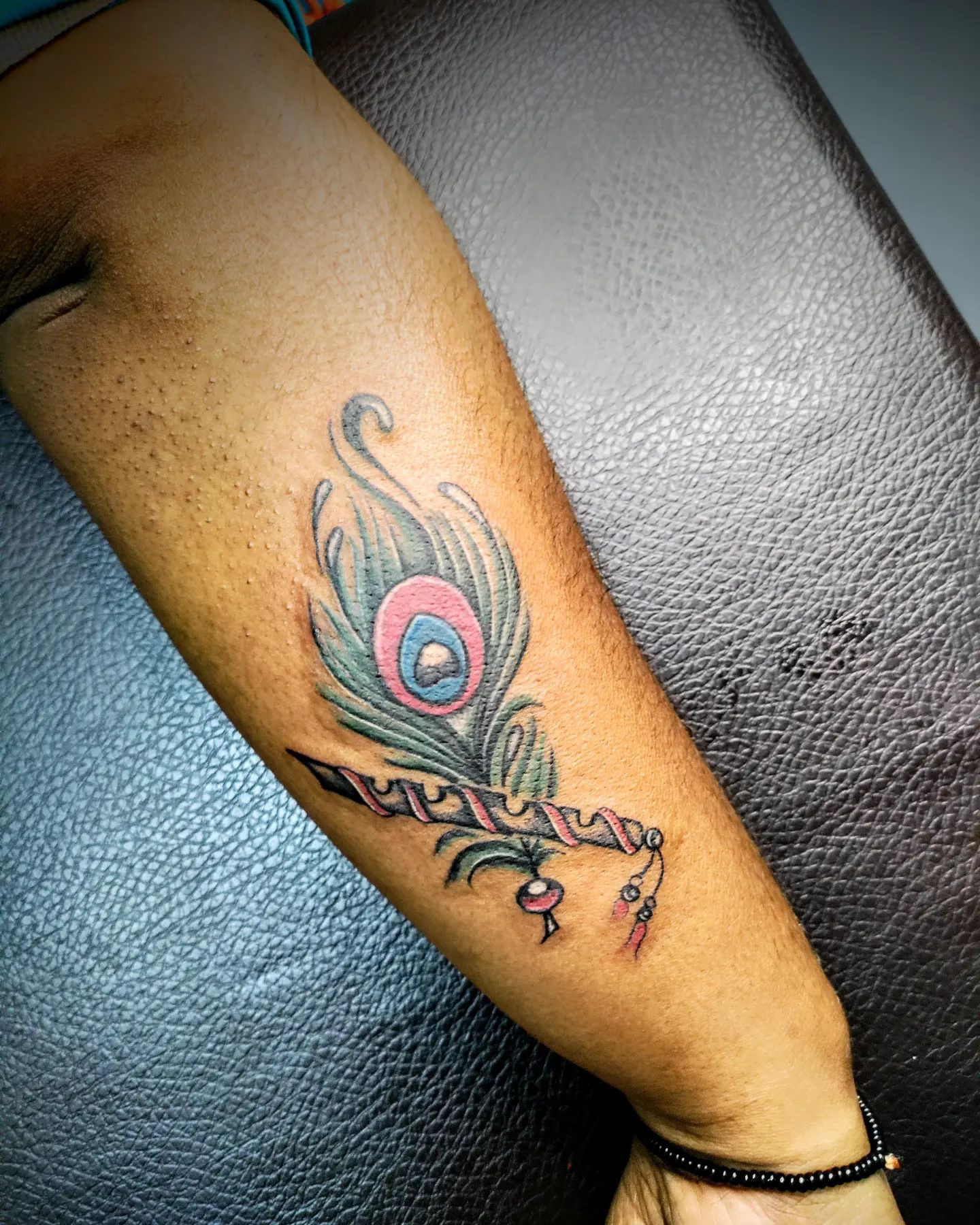 114 Mor Pankh Tattoo Ideas- Embracing Lord Krishna’s Beauty - Psycho Tats