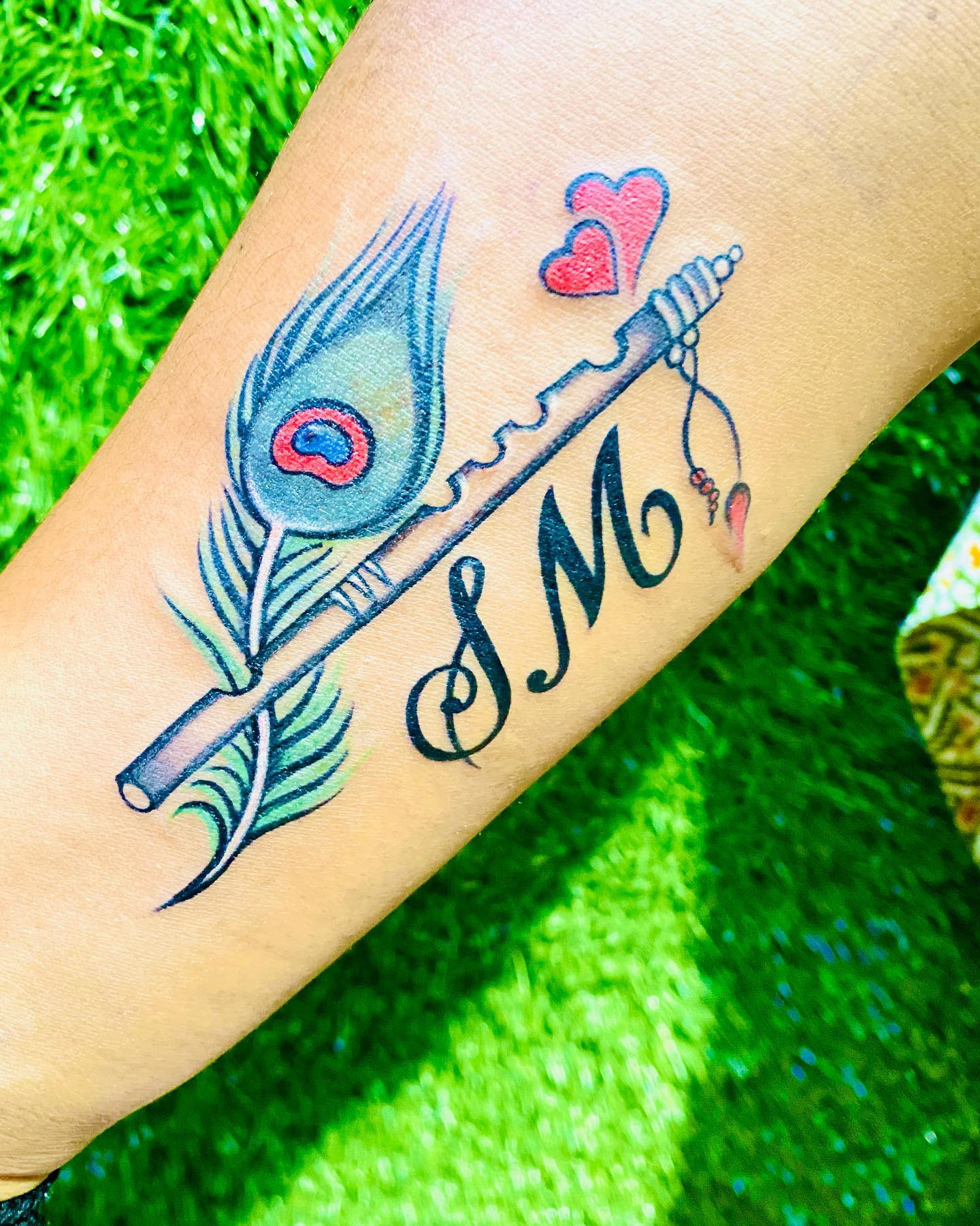 114 Mor Pankh Tattoo Ideas- Embracing Lord Krishna’s Beauty - Psycho Tats