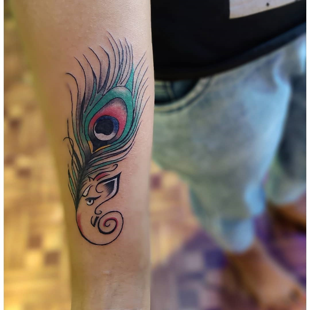 114 Mor Pankh Tattoo Ideas- Embracing Lord Krishna’s Beauty - Psycho Tats